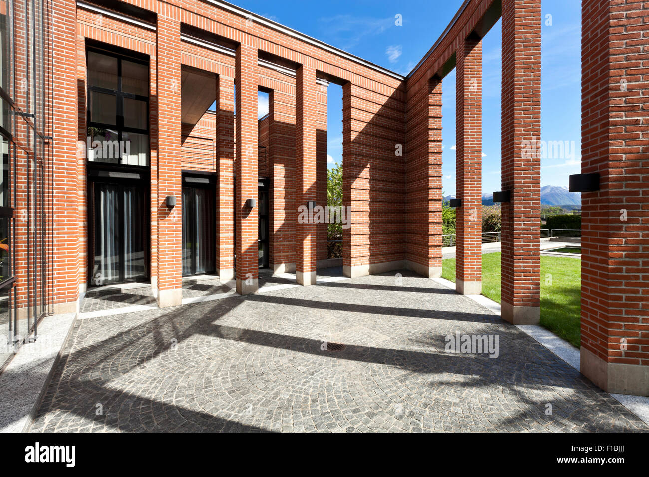 modern bricks house, patio with columns Stock Photo - Alamy
