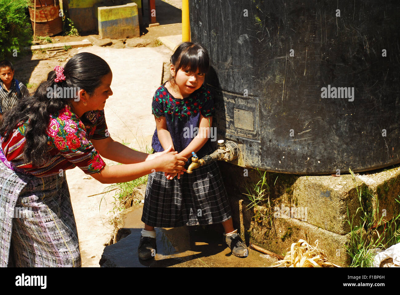 Washing child indigenous hi-res stock photography and images - Alamy