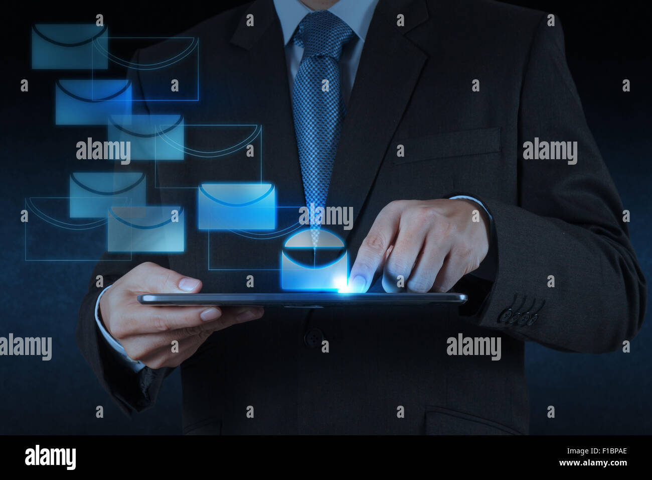businessman hand use tablet computer with virtual email icon Stock ...
