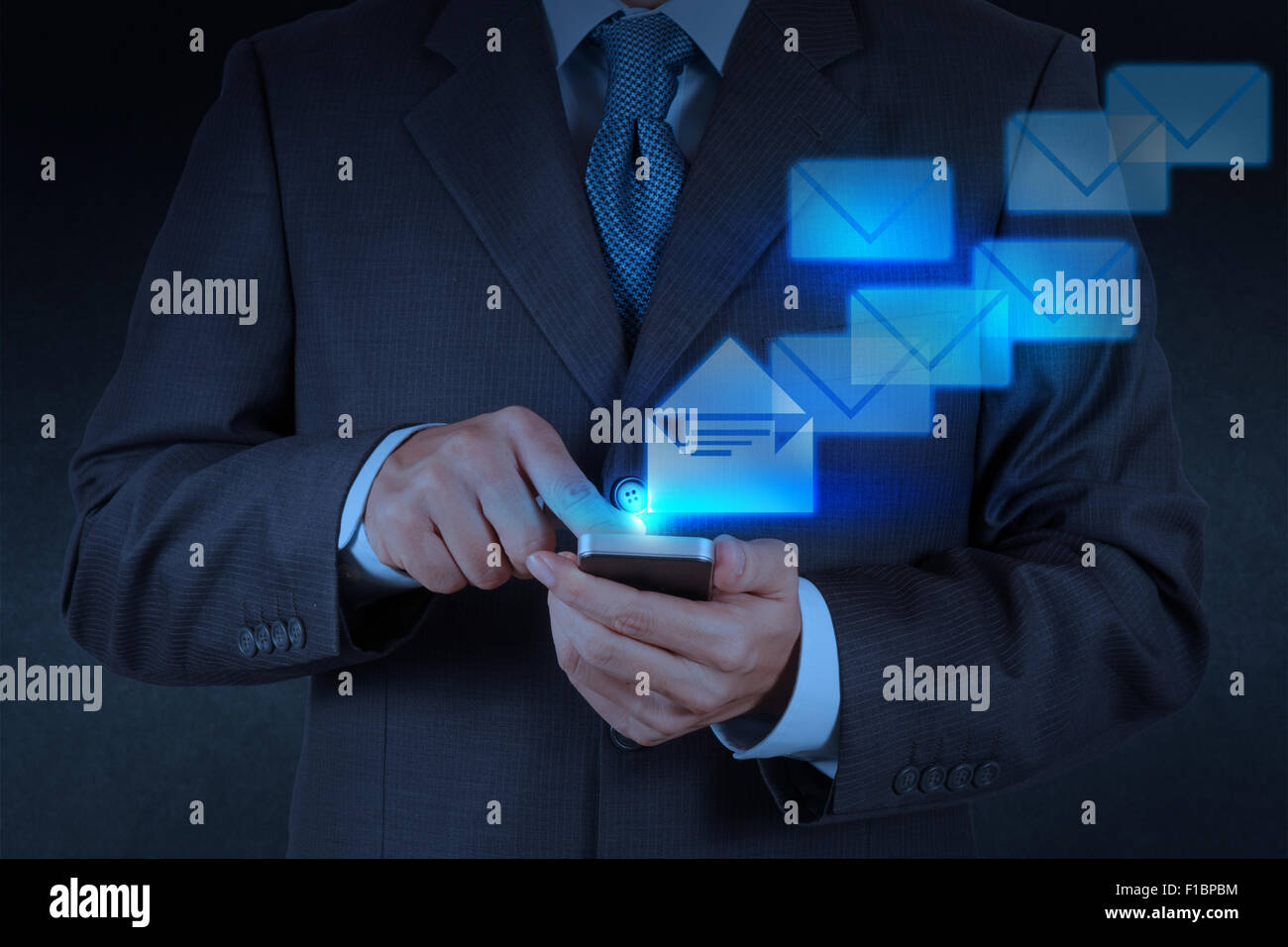 businessman hand use smart phone computer with email icon Stock Photo ...