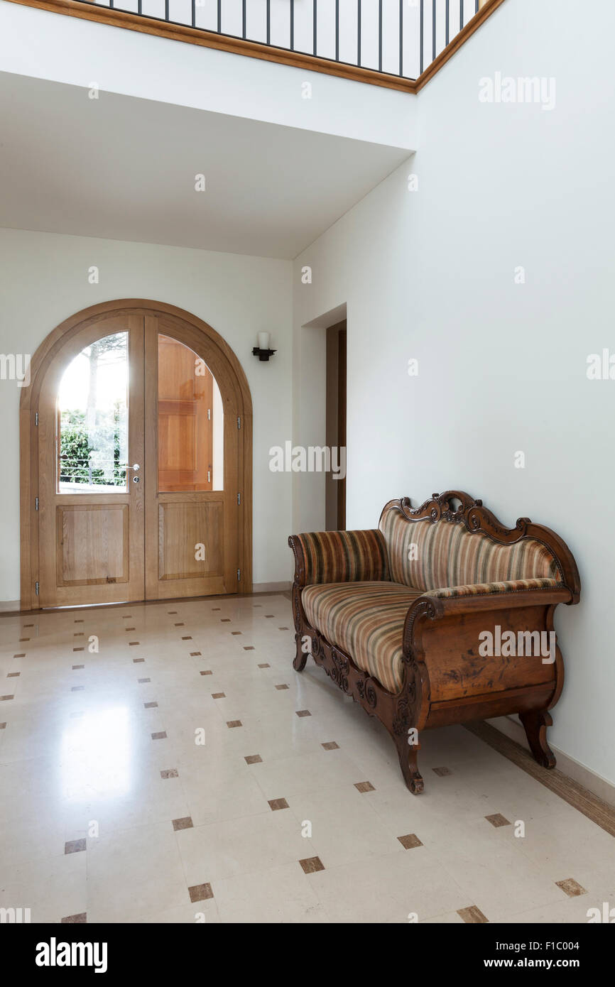 Interior, apartment, corridor with antique sofa Stock Photo - Alamy