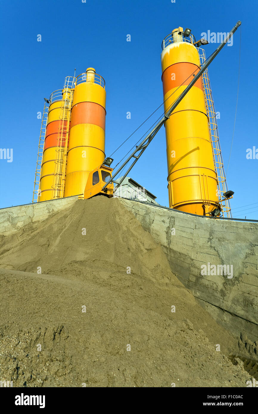 Yellow concrete silos over blue sky Stock Photo - Alamy