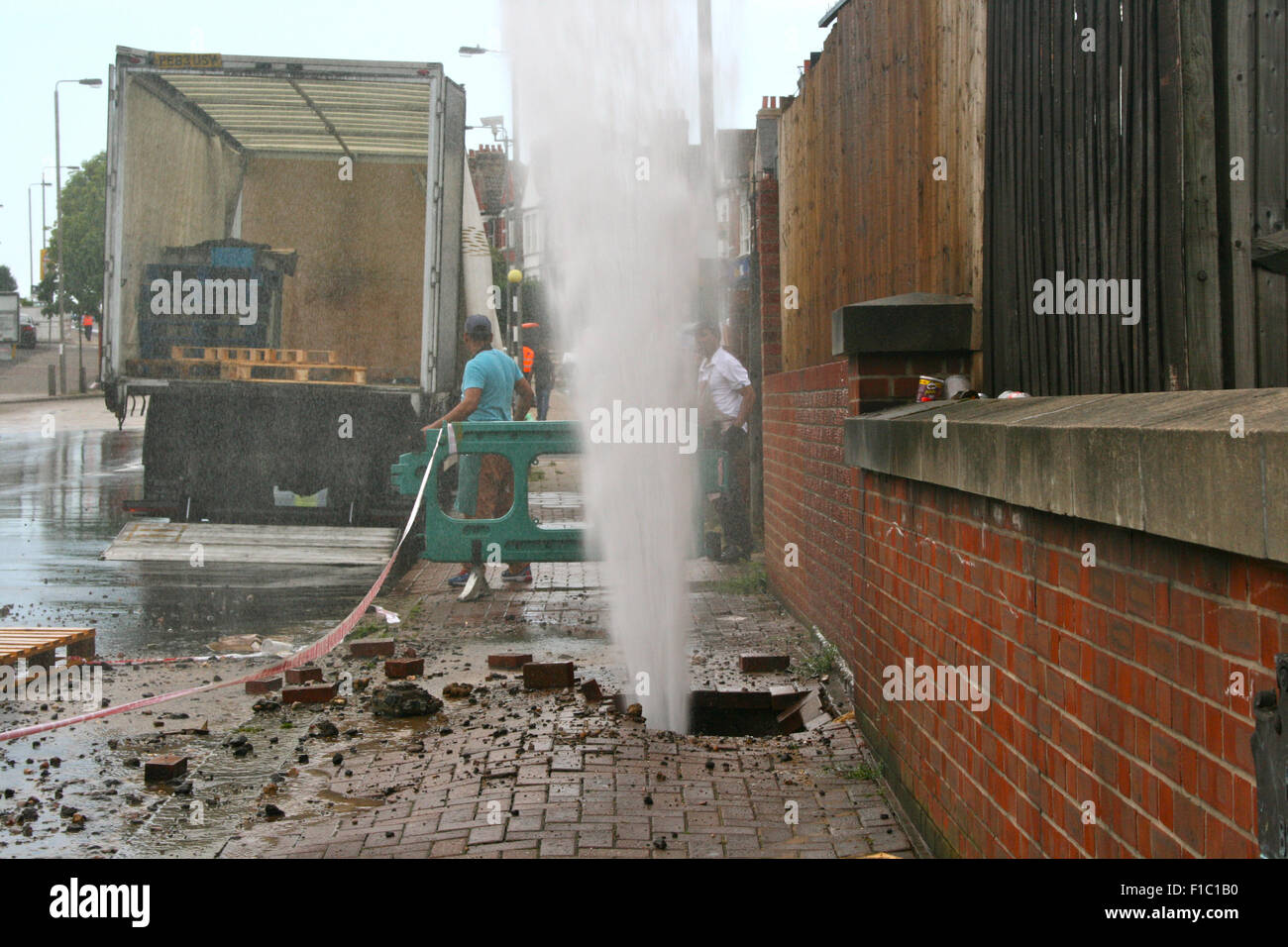 A burst water main sends water 5 stories high in Mitcham Lane, Tooting ...