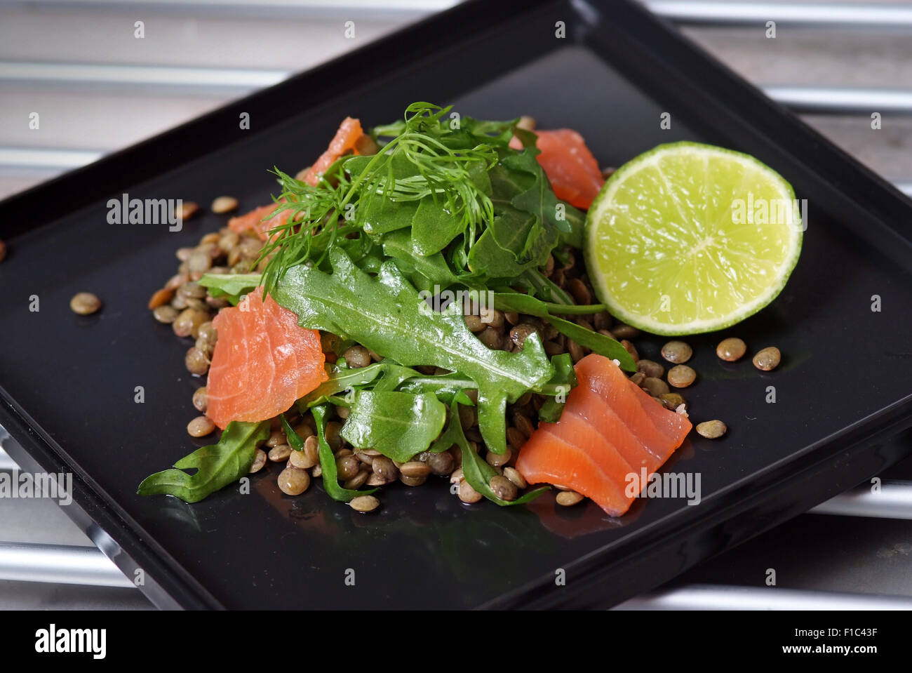 Rocket, salmon, lime & lentil salad Stock Photo - Alamy
