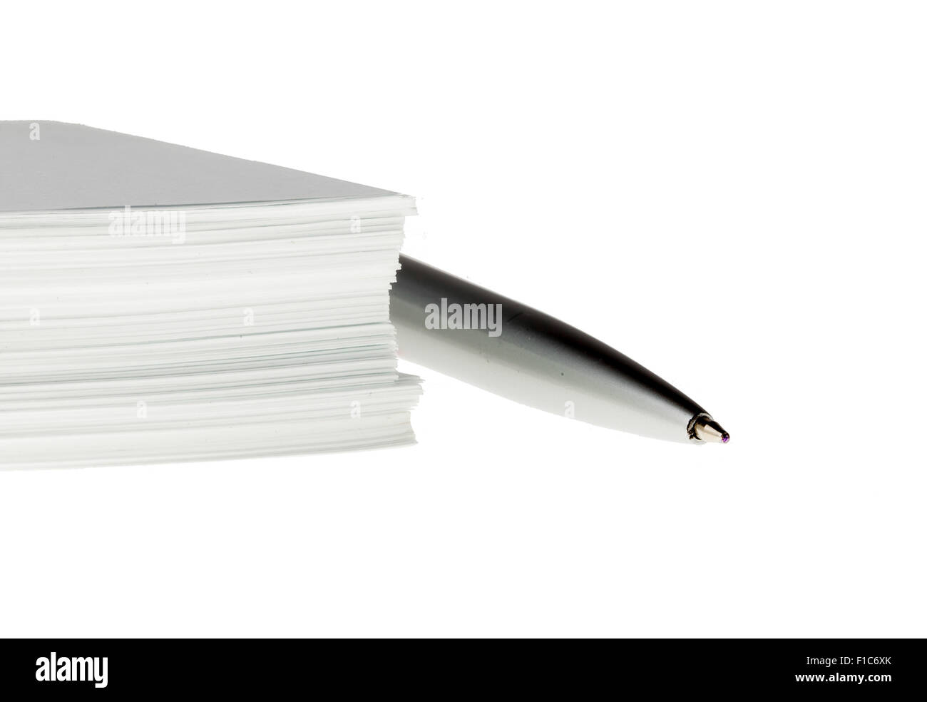 Office paper bundle with pen isolated Stock Photo - Alamy
