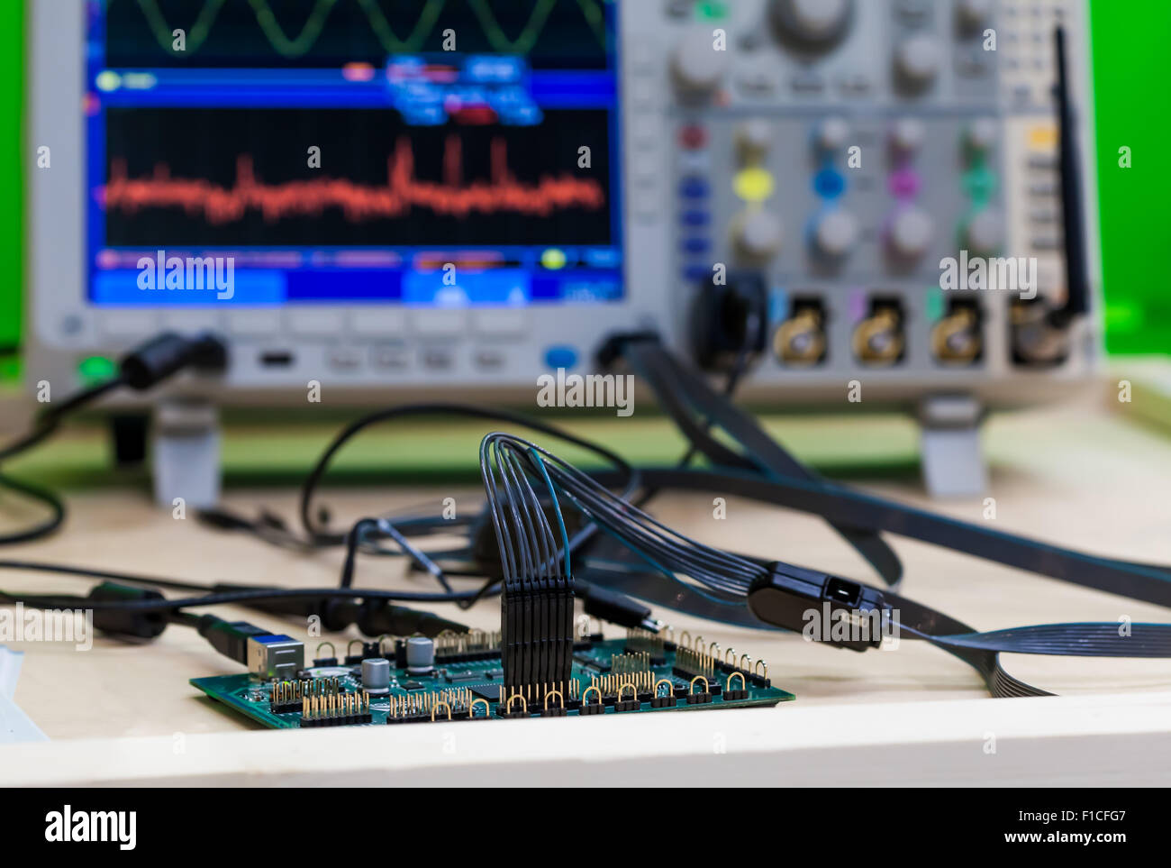 Oscilliscope on table Stock Photo - Alamy