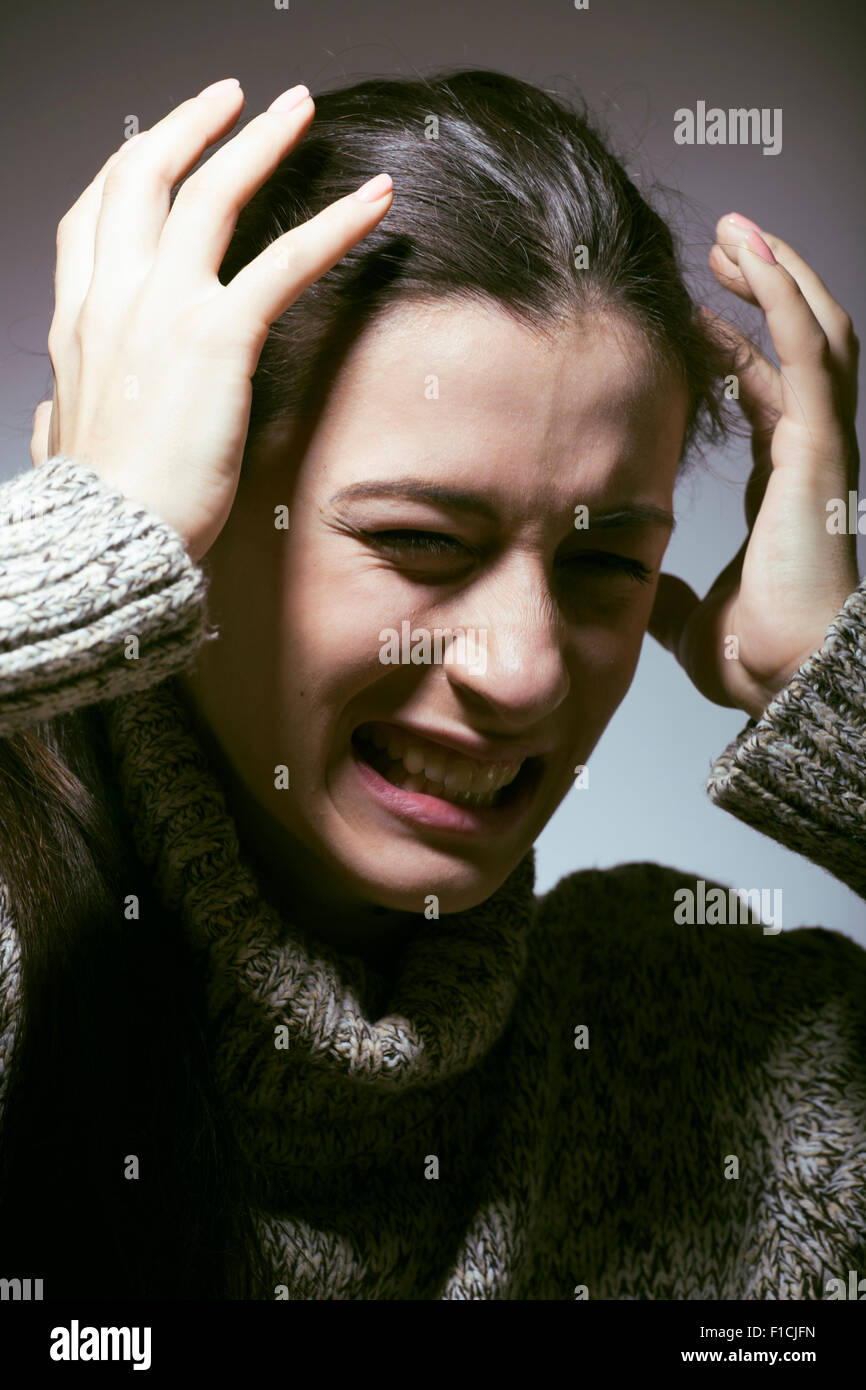 young pretty woman in trouble, screaming grief close up Stock Photo - Alamy