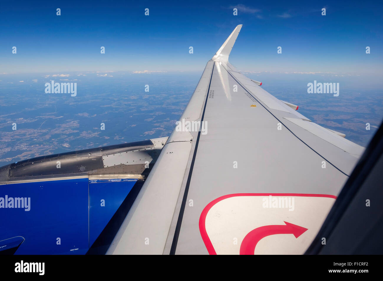 Aerial view over Germany from BA Airbus 320 window showing engine and ...