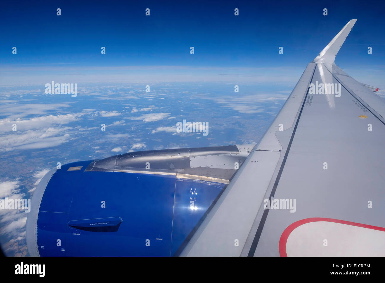 Aerial view over Germany from BA Airbus 320 window showing engine and ...