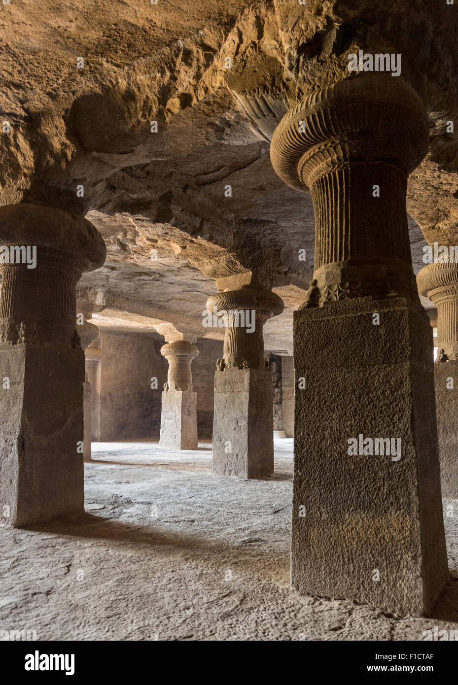 Stone columns of temple carved out of solid rock at the Ellora Caves in ...