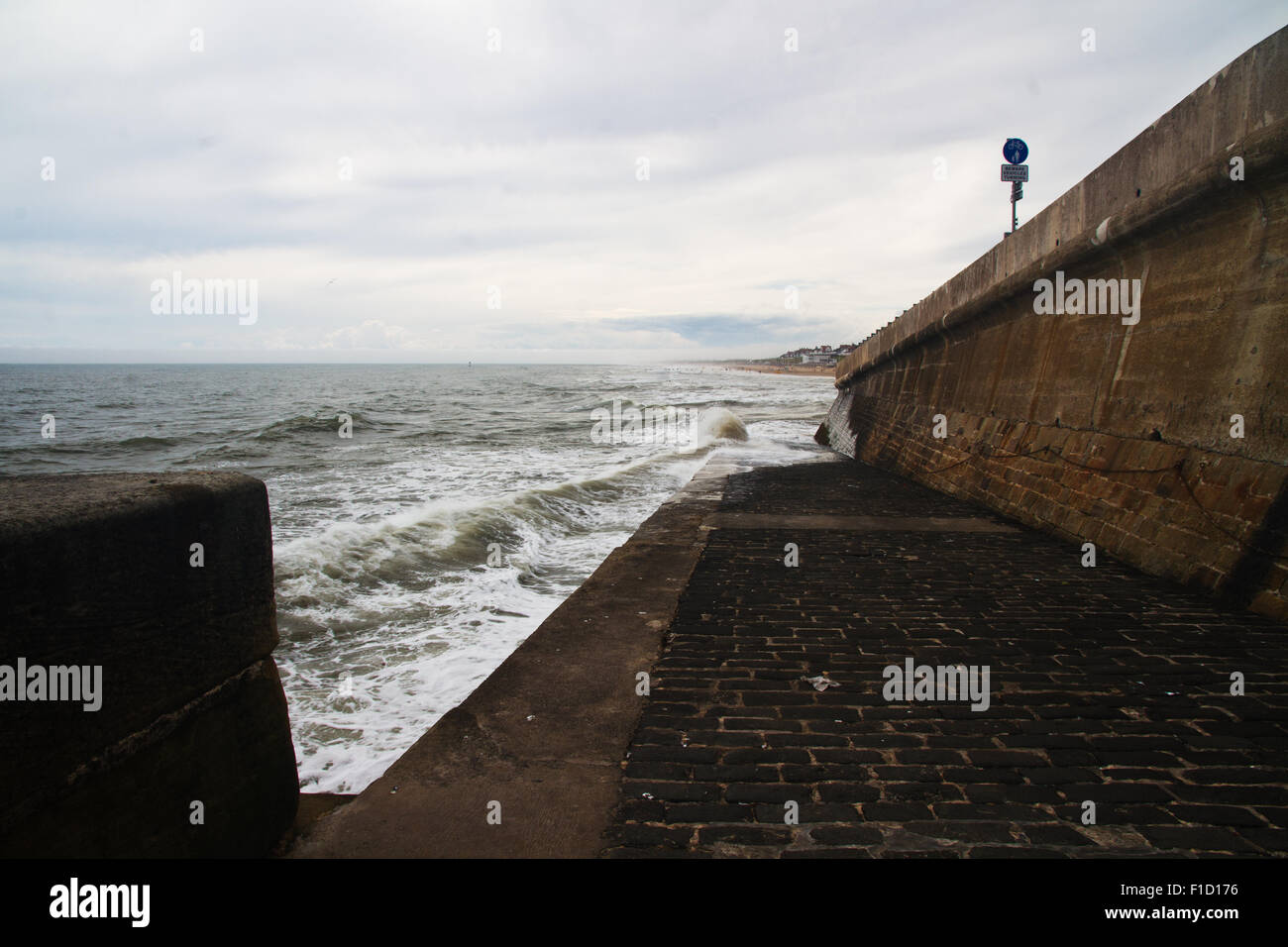 Boat launching ramp pounded by waves Stock Photo - Alamy