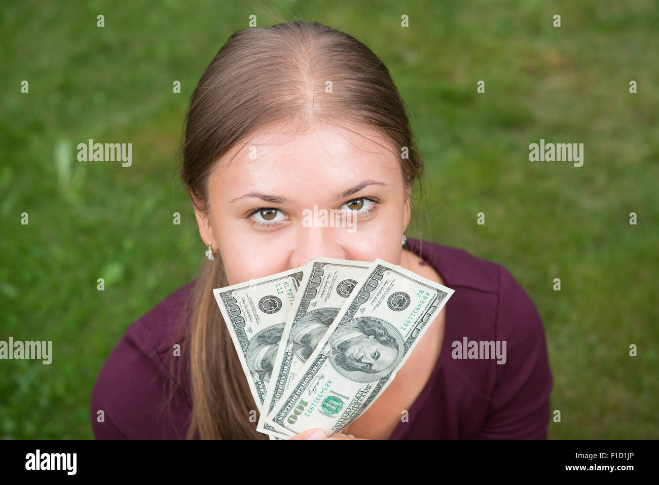 portrait of happy excited successful woman holding money dollar bills ...