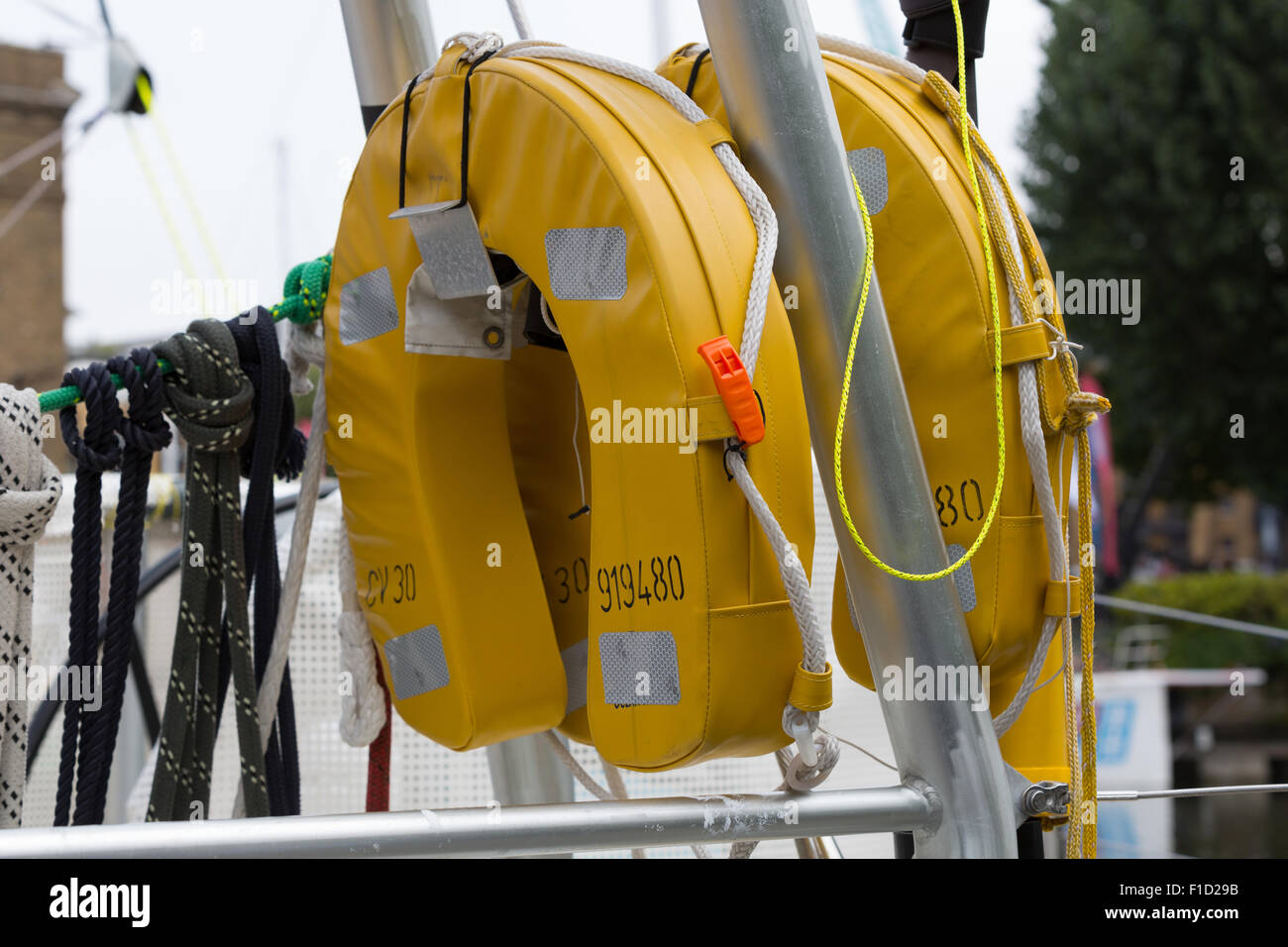 Two yellow Life jackets Stock Photo - Alamy
