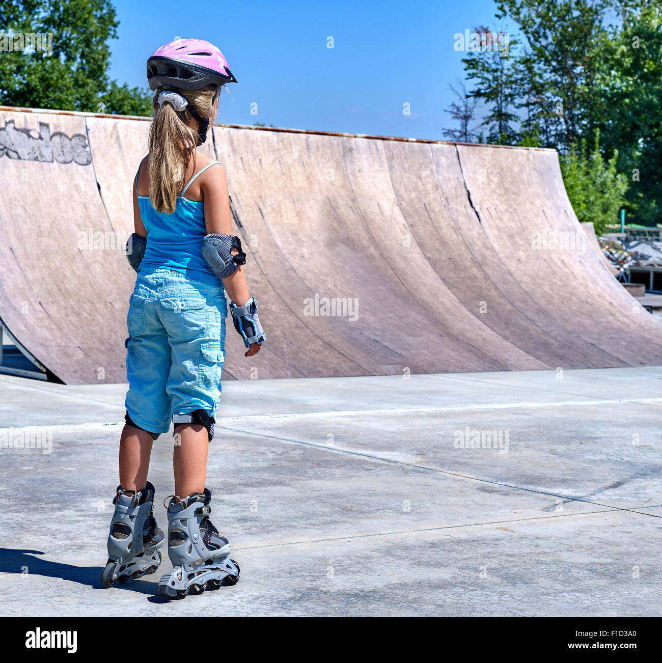 Girl riding on roller skates Stock Photo - Alamy