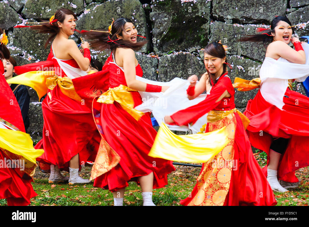 Japanese yosakoi dance team dancing in front of castle stone wall ...