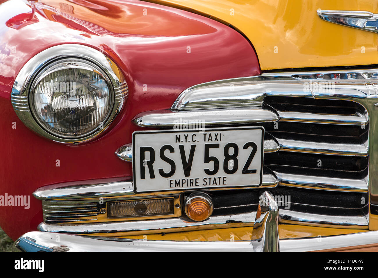 Old New York taxi cab plate on front of yellow cab at Steam rally and ...