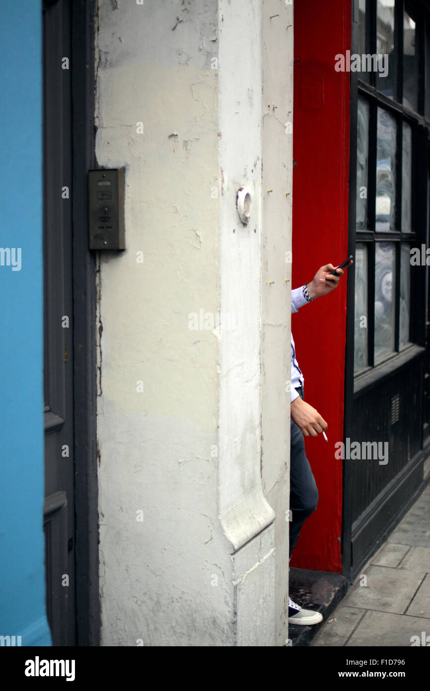 Mobile phone smoking cigarette hi-res stock photography and images - Alamy