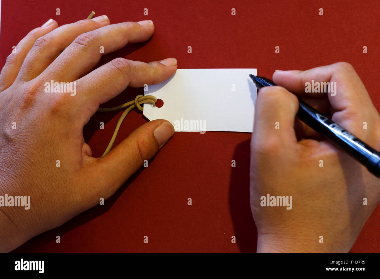 Hand and label hi-res stock photography and images - Alamy