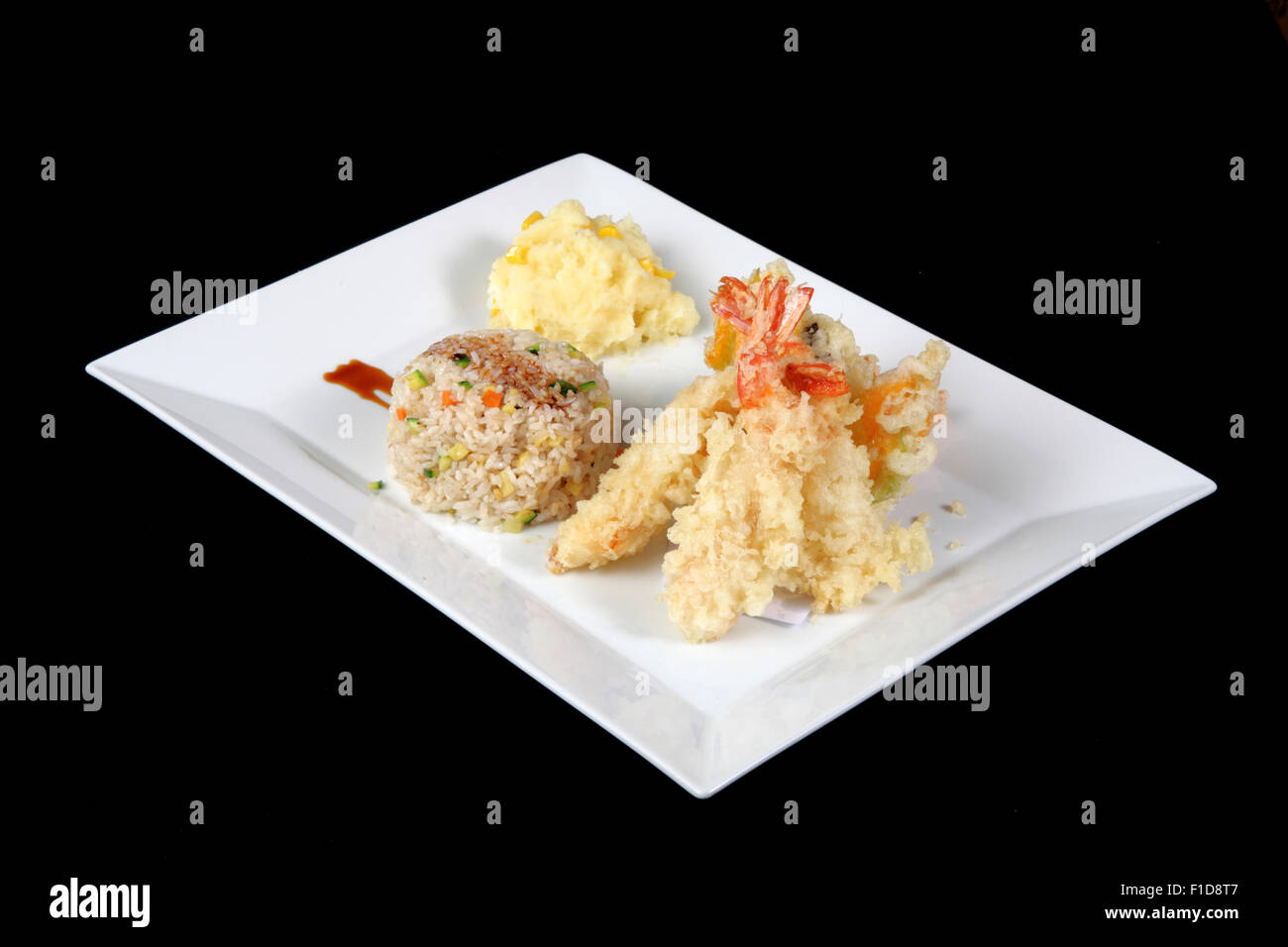 menu of fried fish with rice and mashed potatoes in white dish, on blac ...