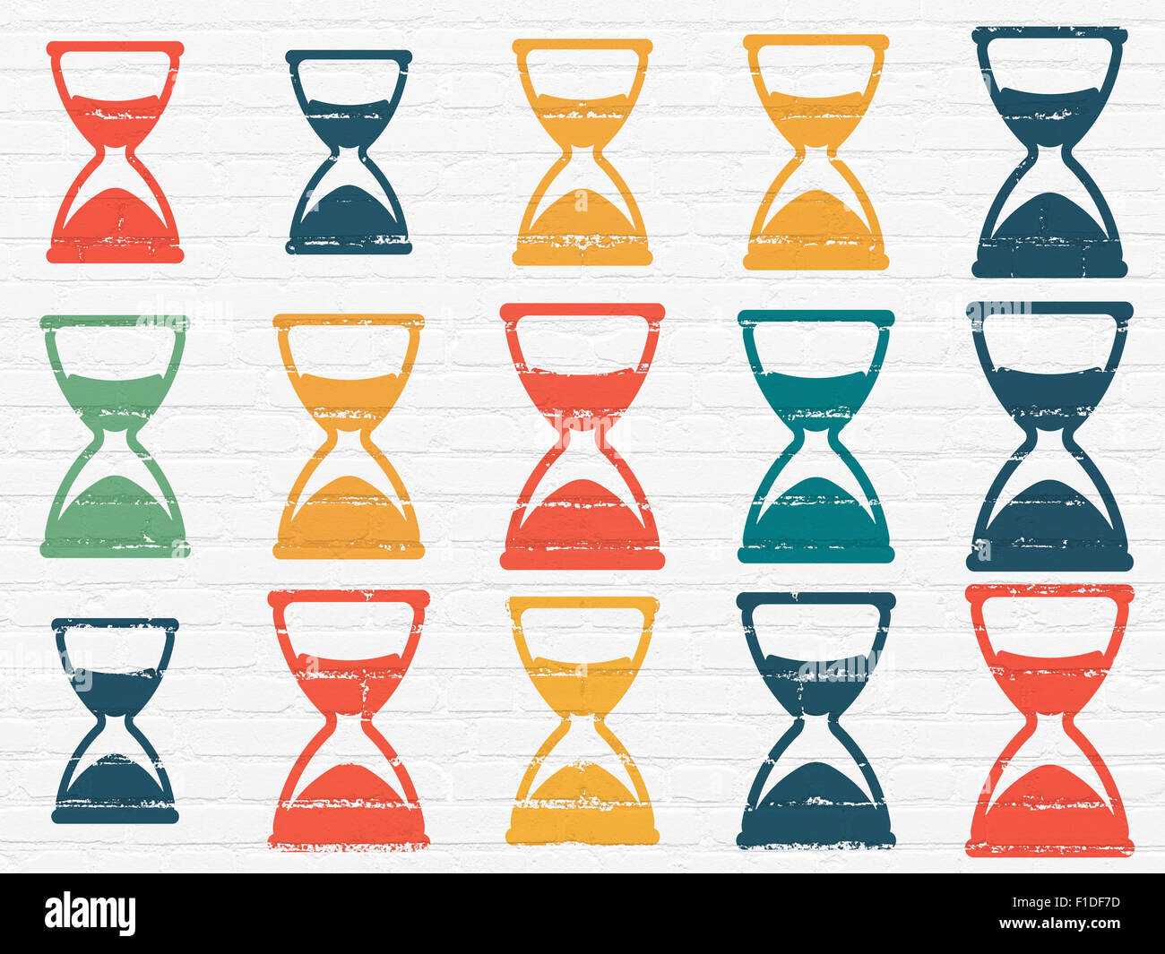 Time concept: Hourglass icons on wall background Stock Photo - Alamy