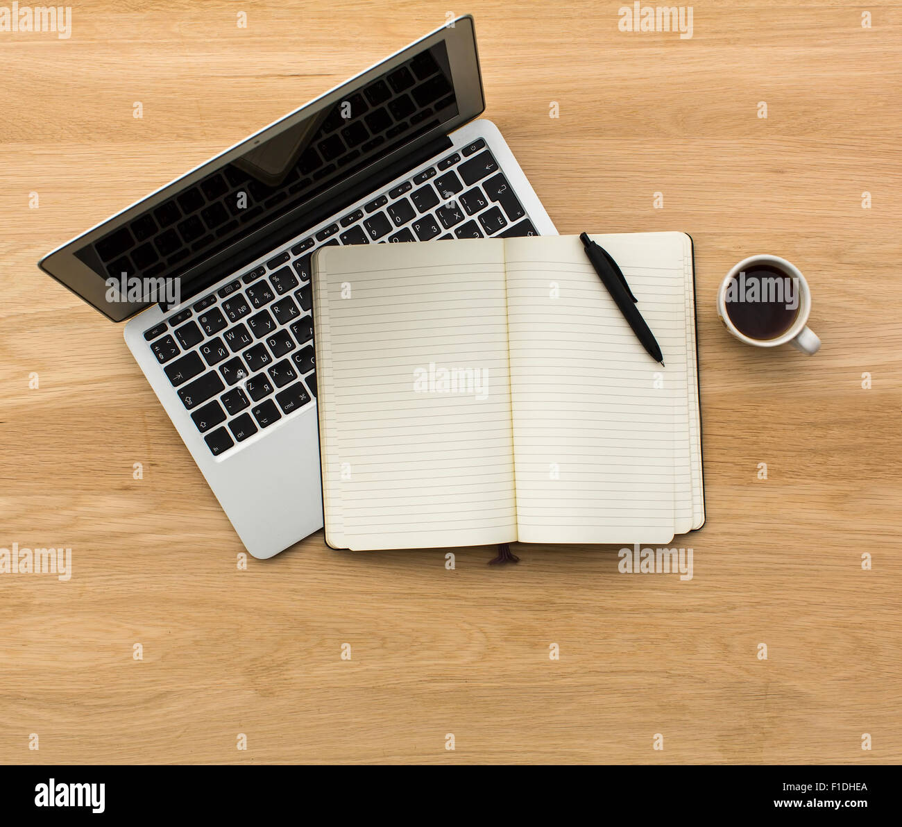 Laptop, Notepad and coffee Cup top view on wooden table texture Stock ...