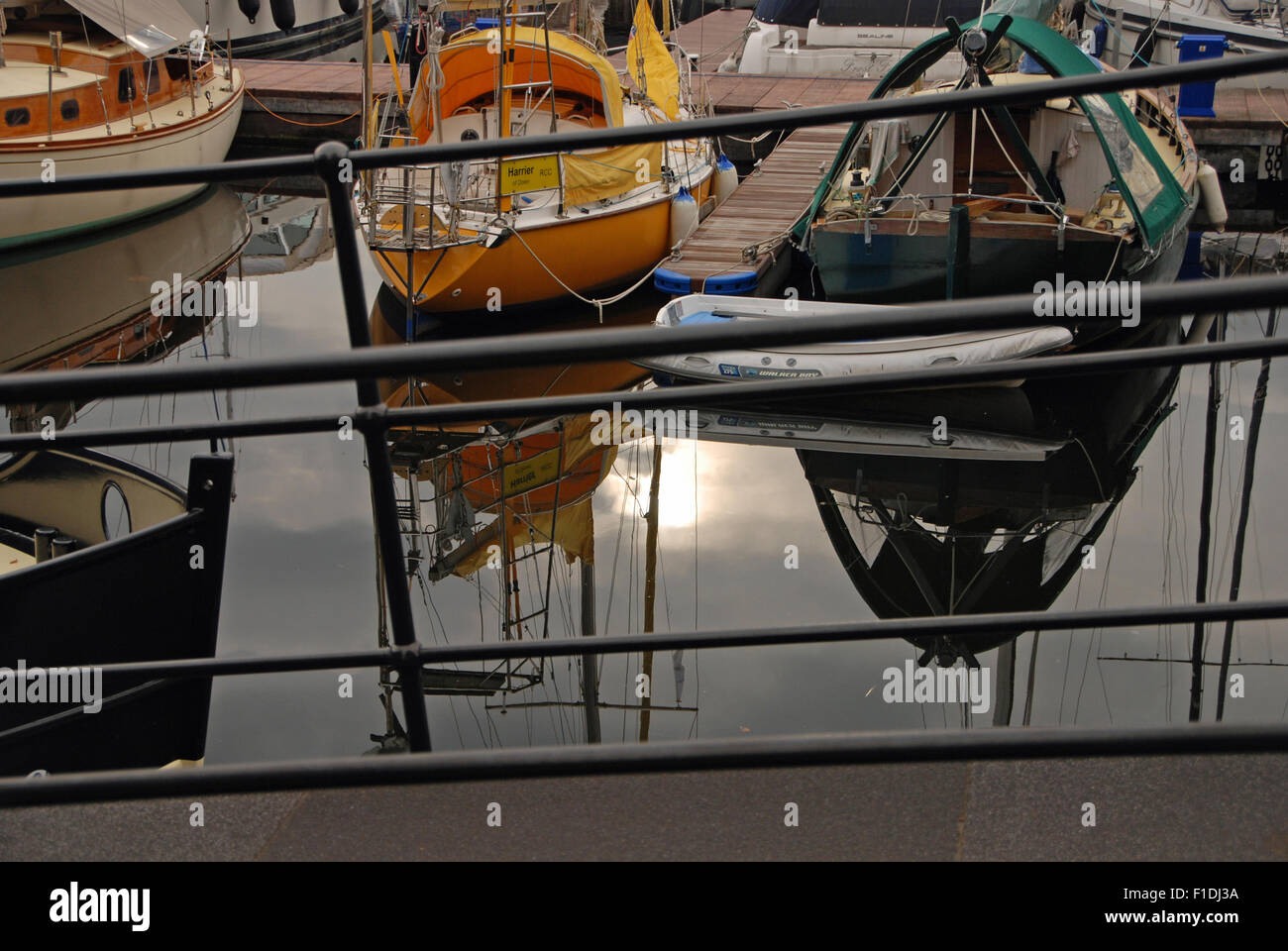 Boats and yachts water reflection sun and clouds at St. Katherine's ...