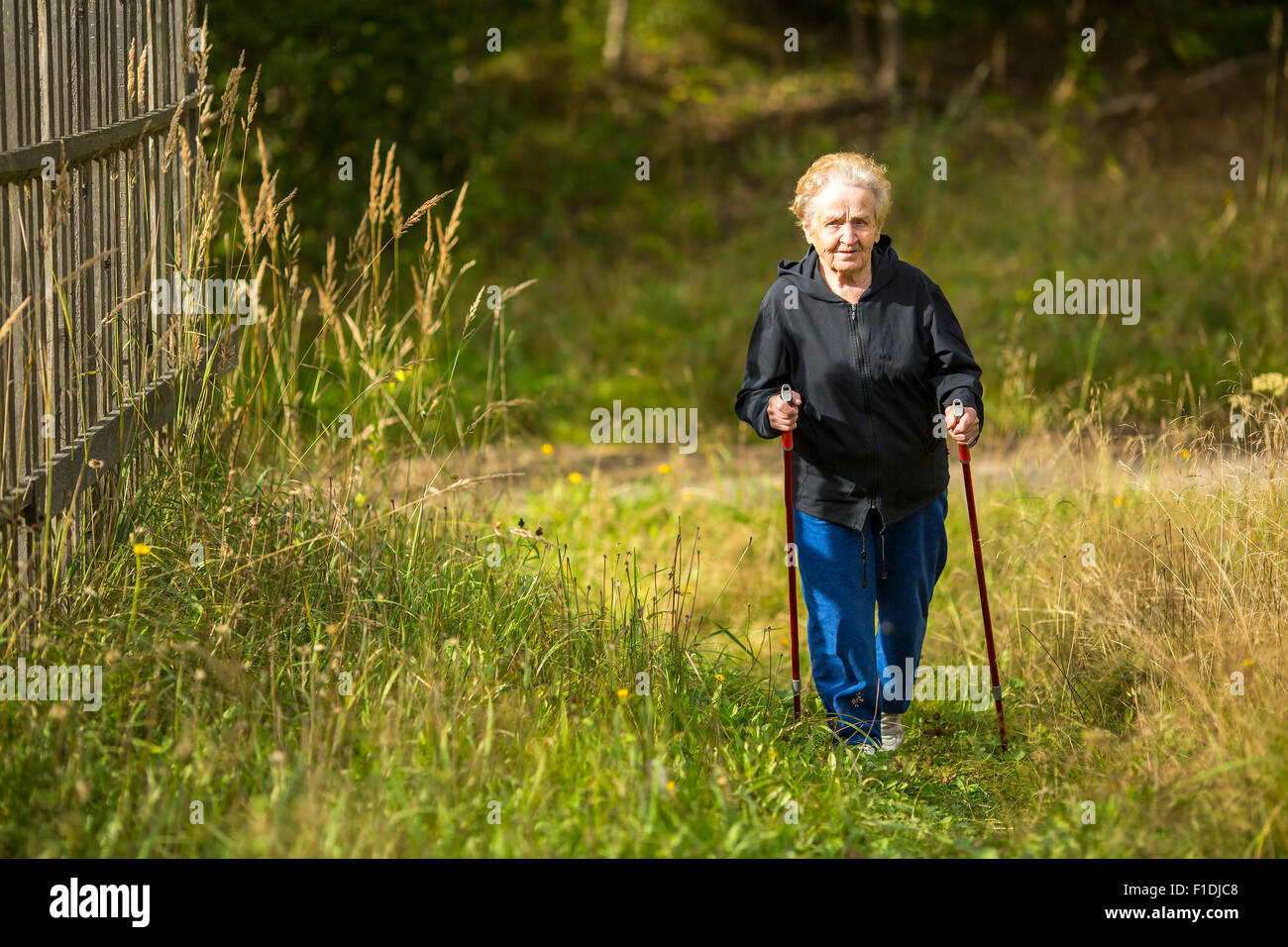 Mature woman walking outside hi-res stock photography and images - Alamy