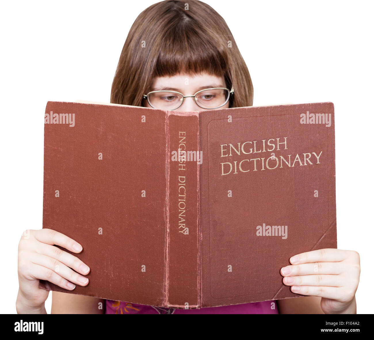 girl with spectacles reads big English Dictionary book isolated on ...