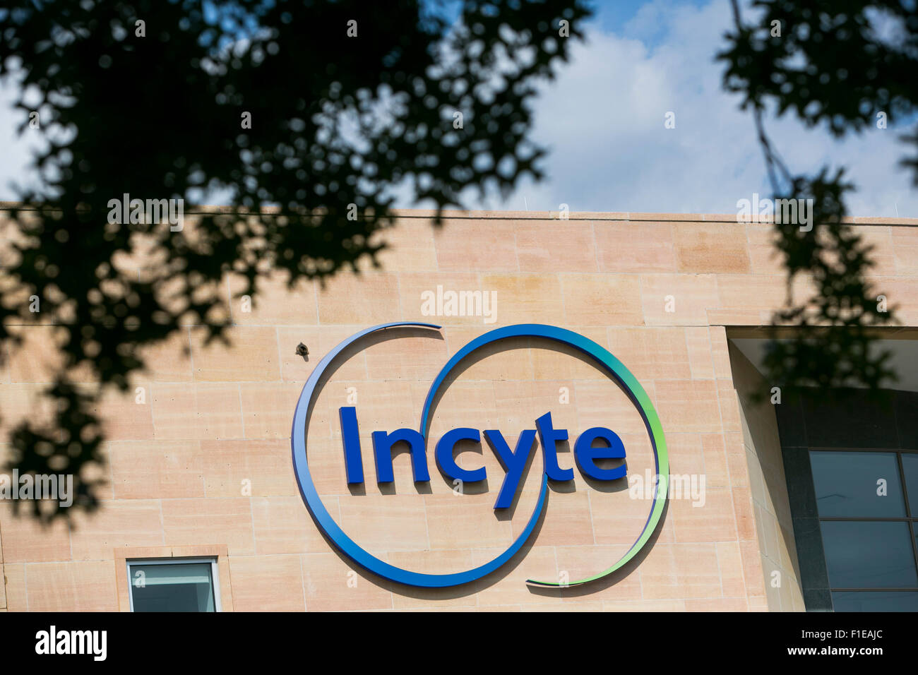 A logo sign outside of the headquarters of the Incyte Corporation in ...