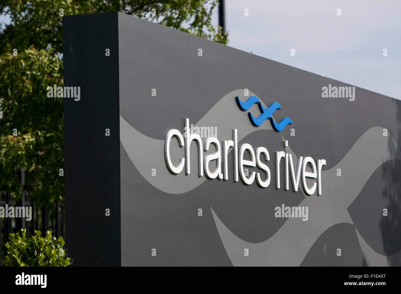 A logo sign outside of a facility occupied by Charles River ...