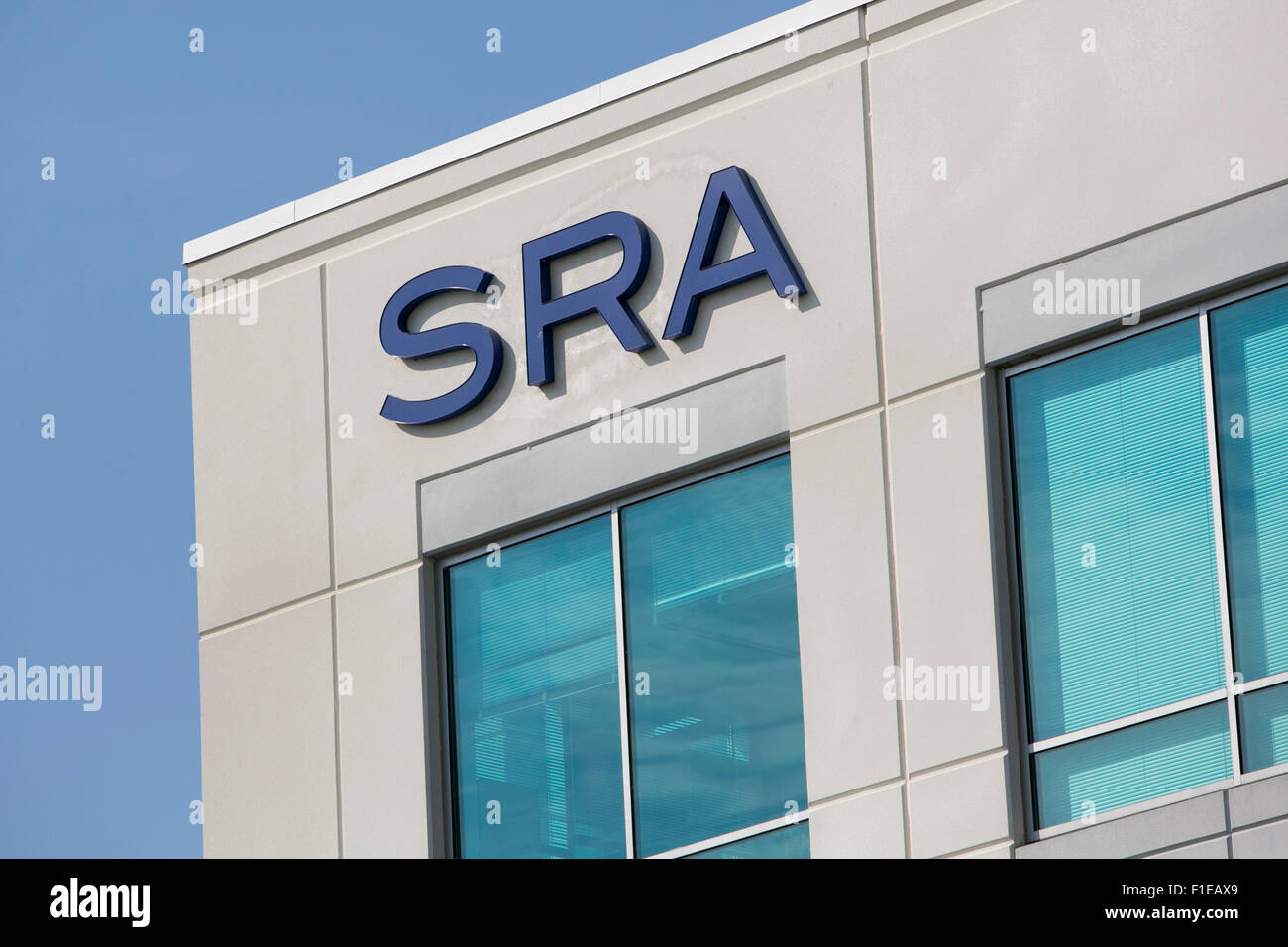 A logo sign outside of a facility occupied by SRA International, Inc ...