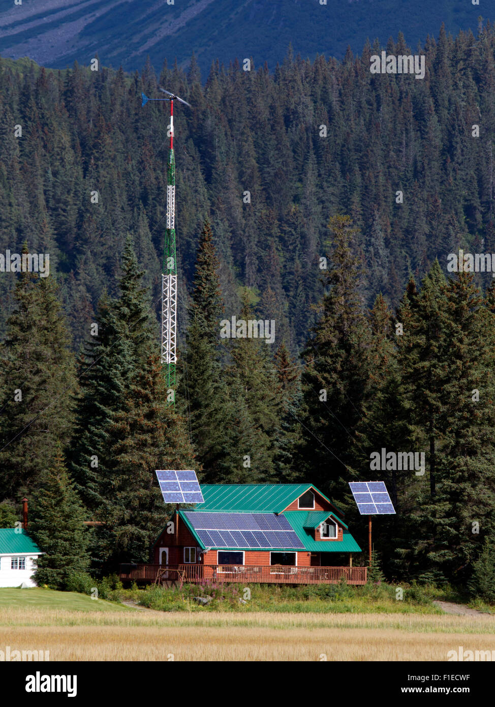 Cabin with Solar Panels and Wind Generator Stock Photo - Alamy