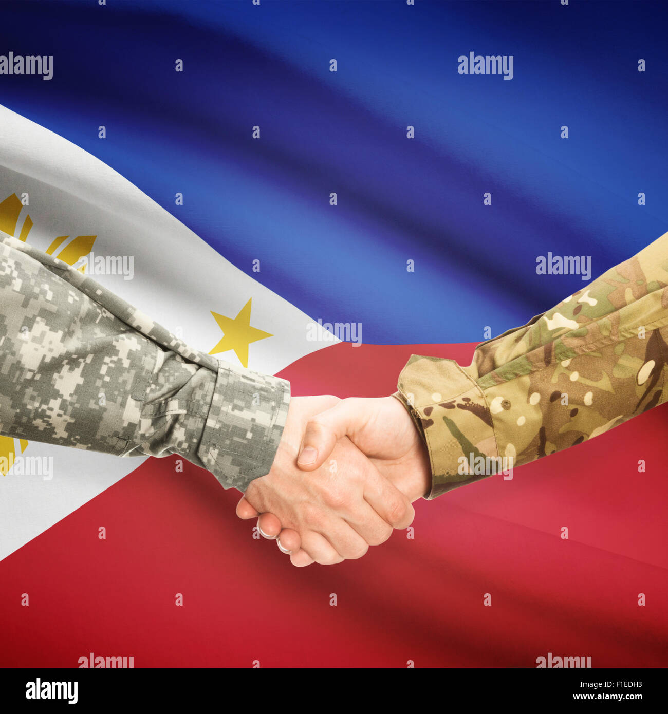Soldiers shaking hands with flag on background - Philippines Stock ...