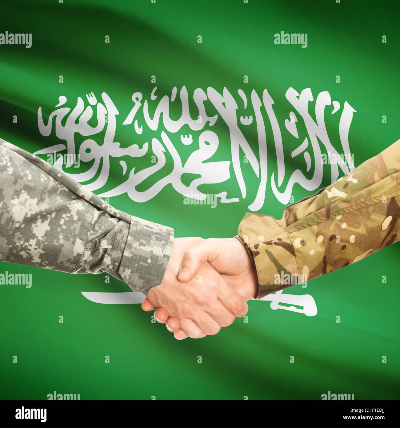 Soldiers shaking hands with flag on background - Saudi Arabia Stock ...