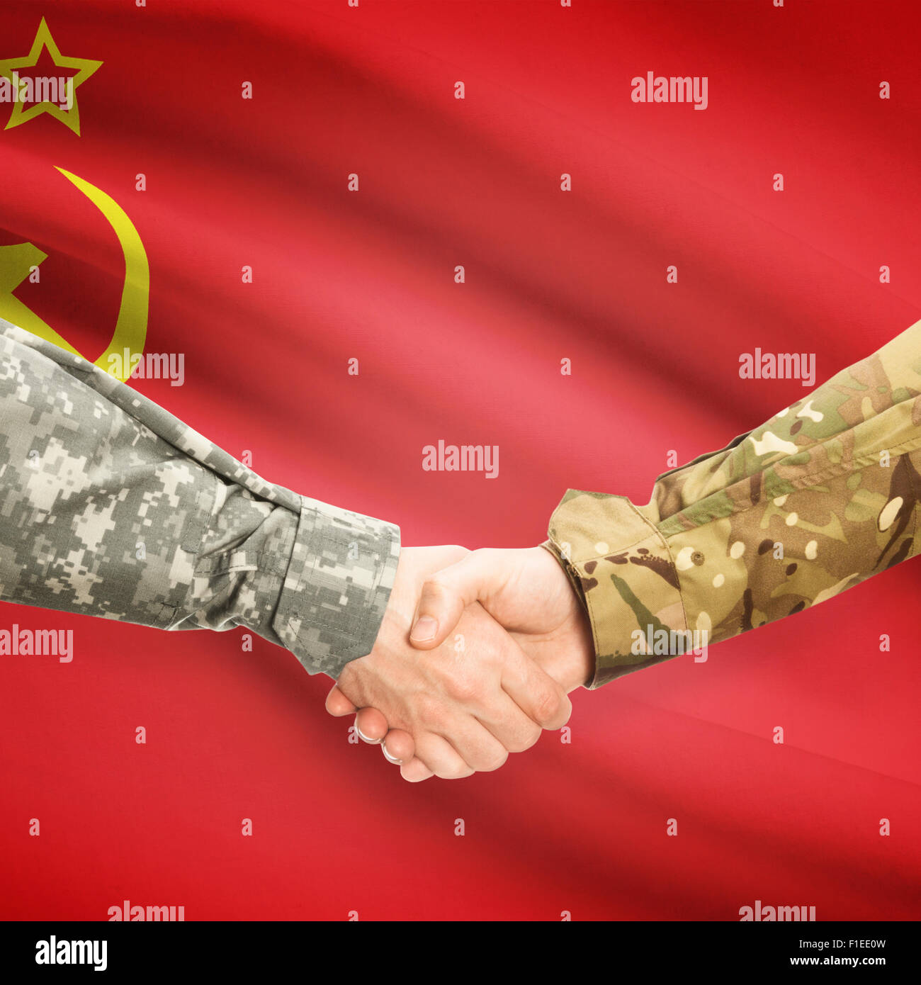 Soldiers shaking hands with flag on background - USSR Stock Photo - Alamy