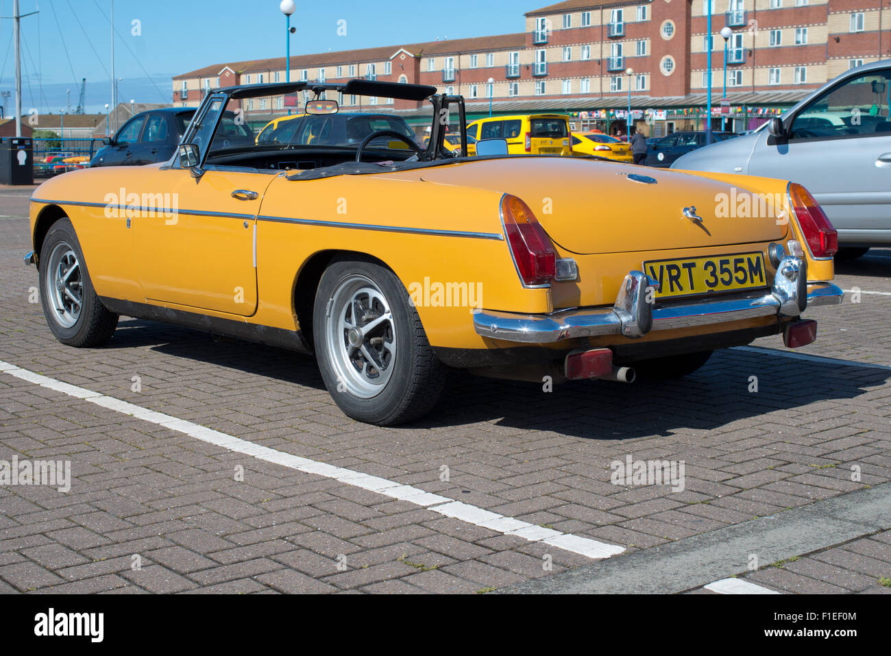 Yellow MGB sports car Stock Photo - Alamy