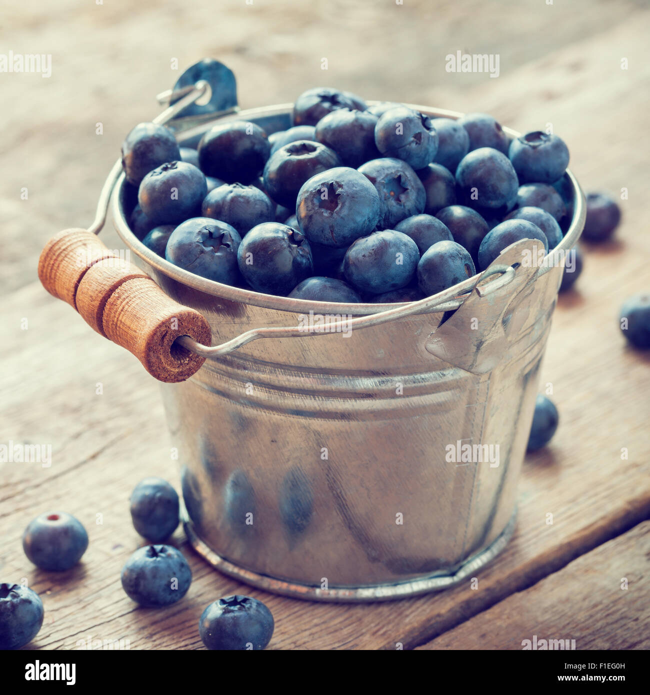 Bucket of blueberry. Retro stylized Stock Photo - Alamy
