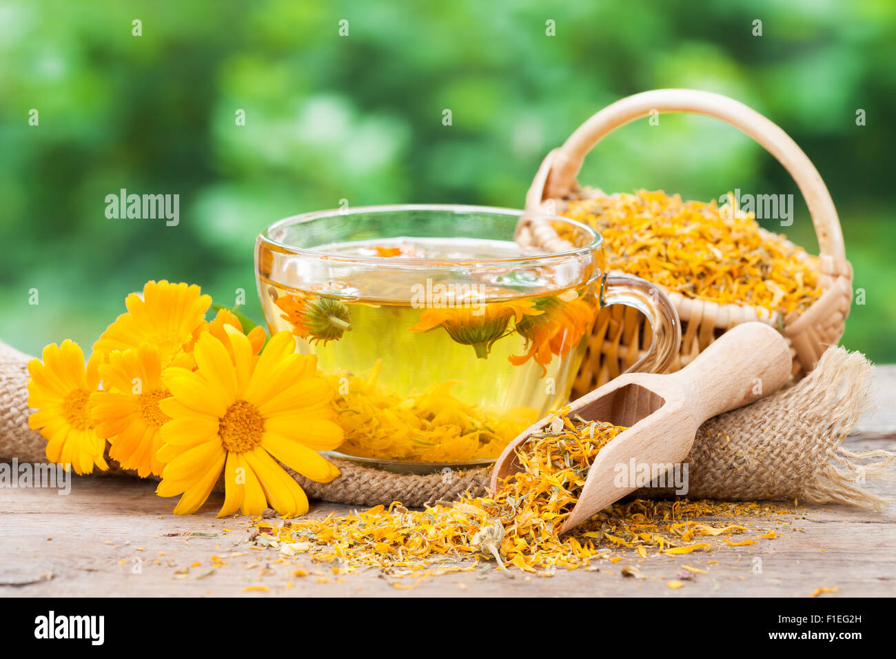 Cup of healthy marigold tea and calendula flowers Stock Photo - Alamy