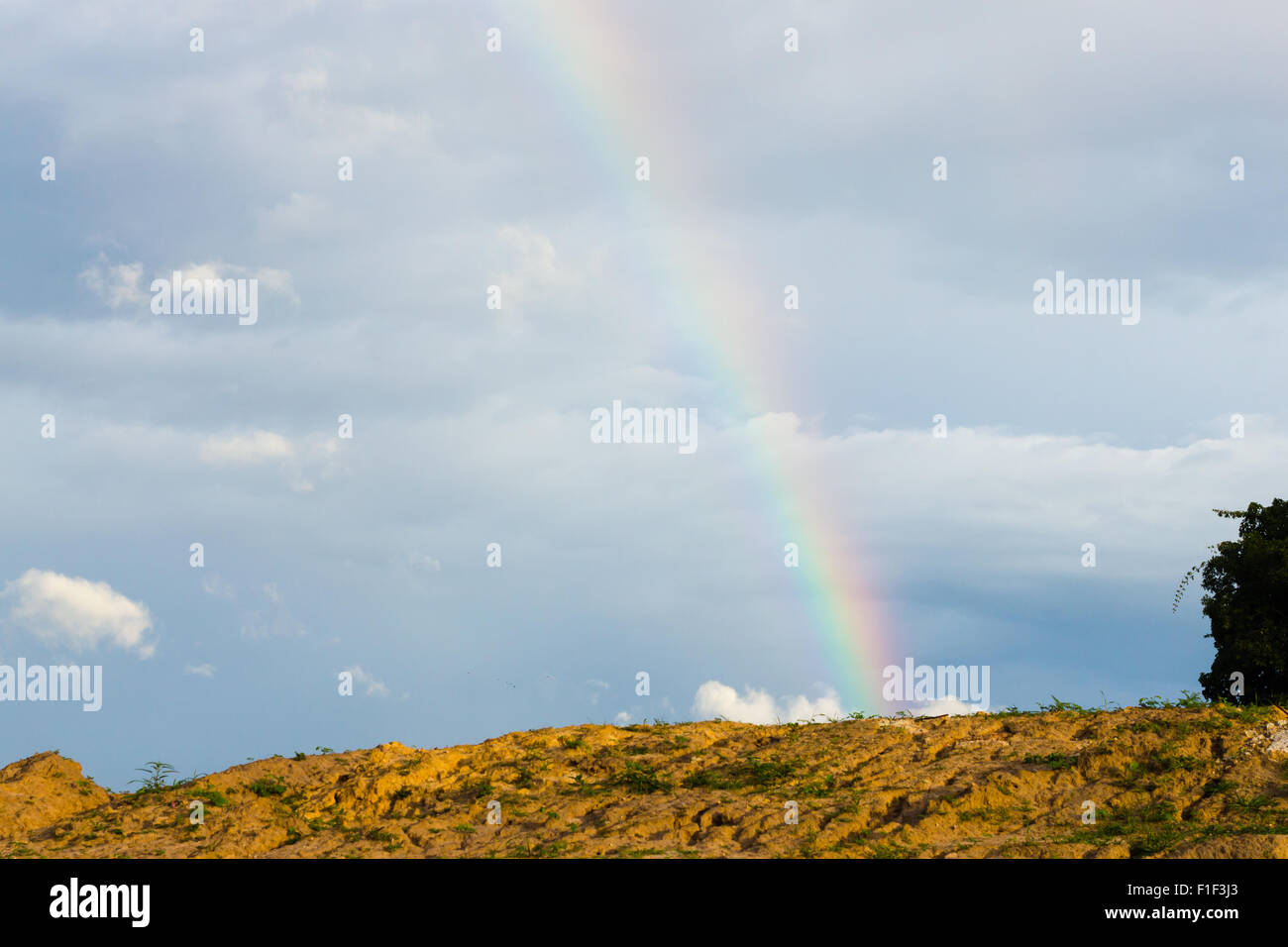 End of rainbow with the blue sky Stock Photo - Alamy