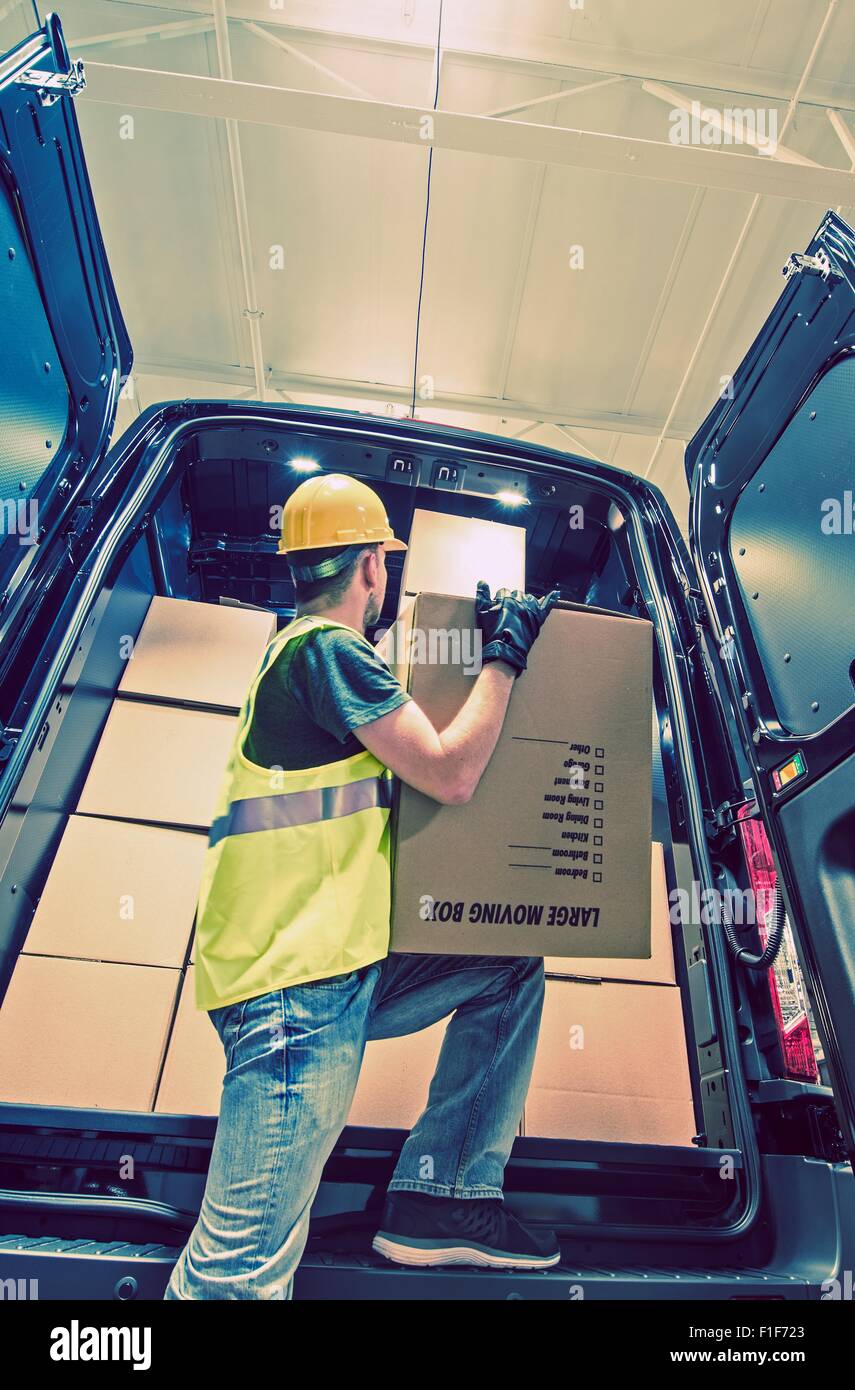 Shipment Van Delivery. Men Reloading Cargo From the Van. Shipping and ...