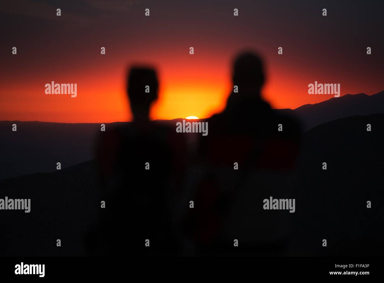 Lovely couple watching sunset woman hi-res stock photography and images ...