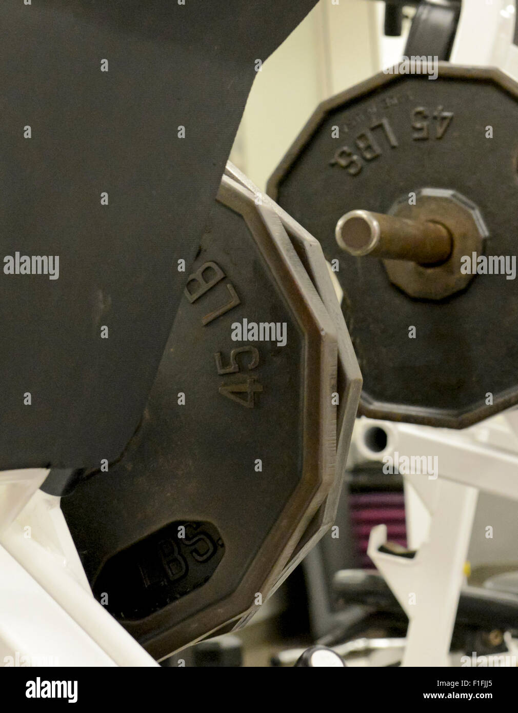 iron weight plates and exercise equipment at gym Stock Photo - Alamy