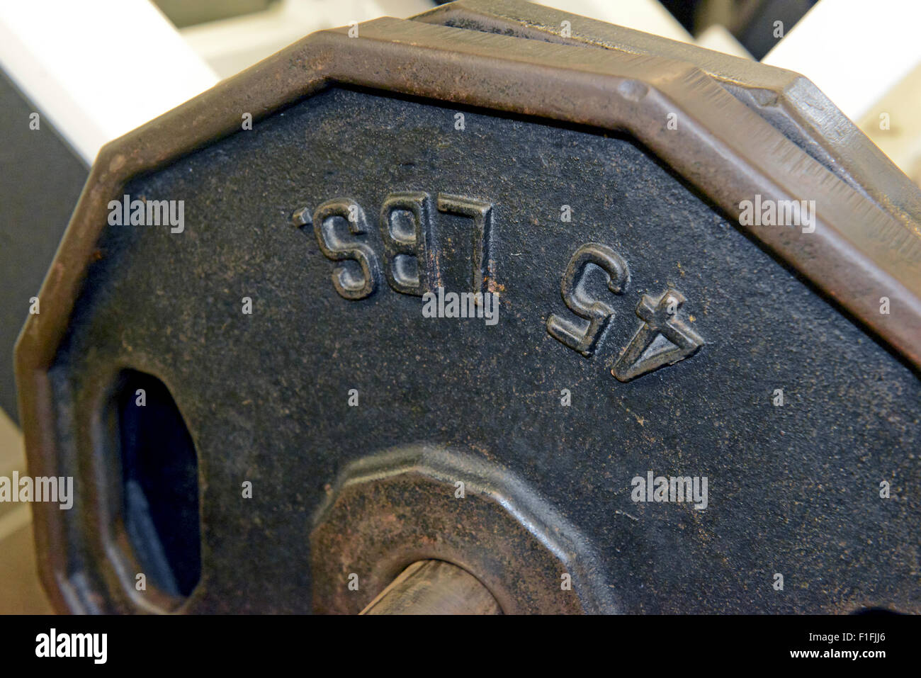 iron weight plates and exercise equipment at gym Stock Photo - Alamy