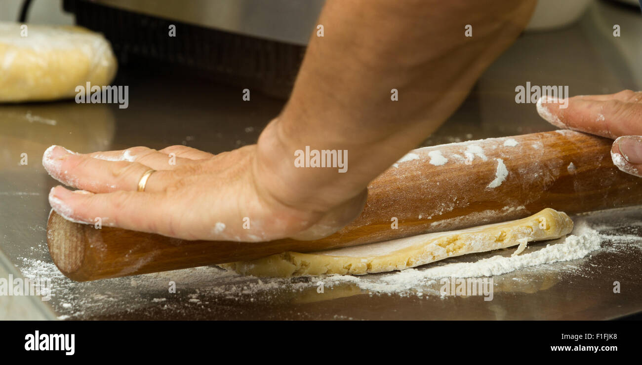 close up of a professional chef rolling dough for pie crust Stock Photo ...