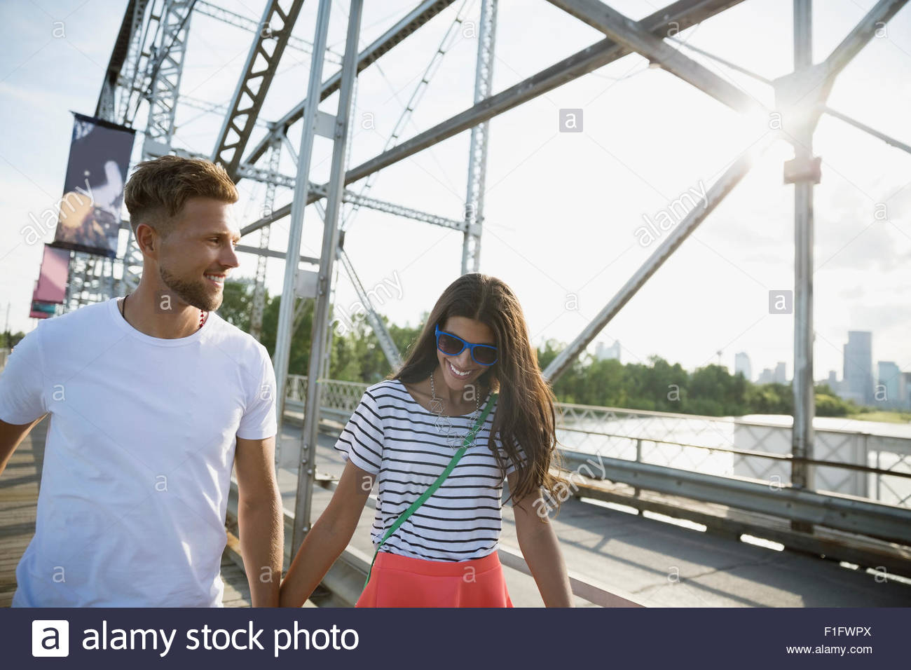 Couple walking on bridge hi-res stock photography and images - Alamy