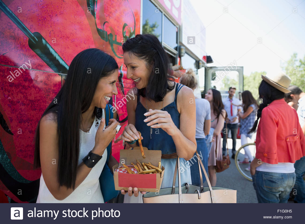 Man eating french fries hi-res stock photography and images - Alamy