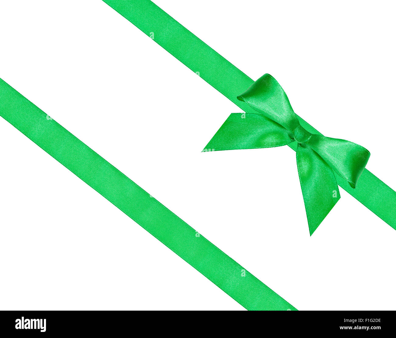 big green bow knot on two diagonal silk ribbons isolated on white ...