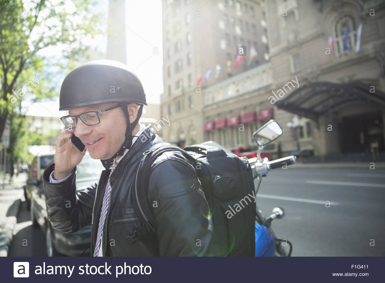 Businessman commuting on motorcycle hi-res stock photography and images ...
