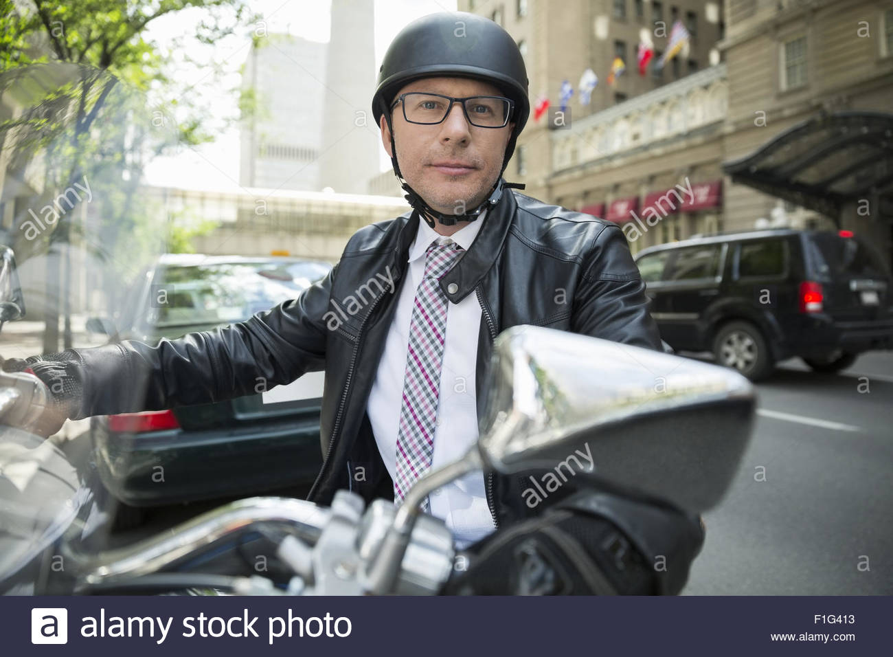 Businessman commuting on motorcycle hi-res stock photography and images ...
