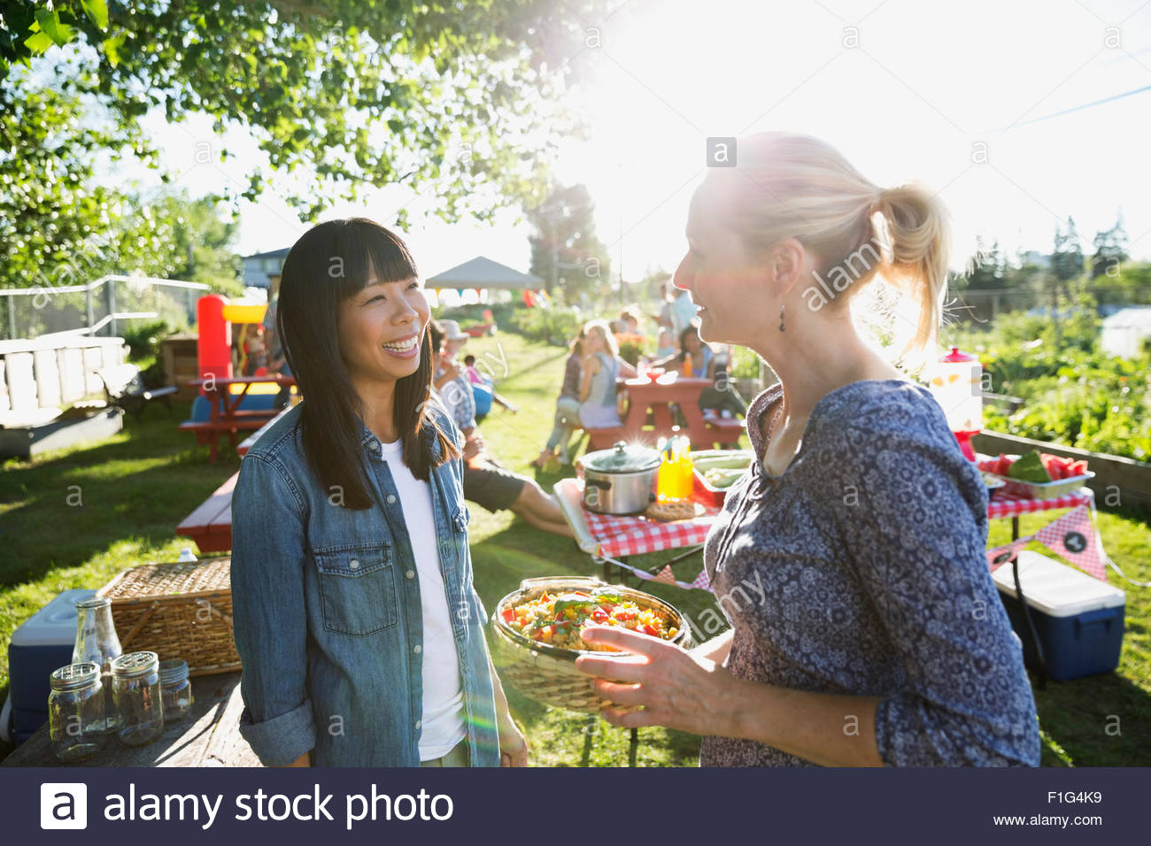 Women talking standing outdoors hi-res stock photography and images - Alamy